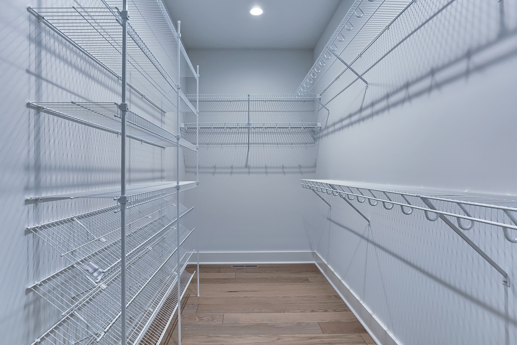 v Primary Bedroom Walk in Closet | Roland Builder, Inc.